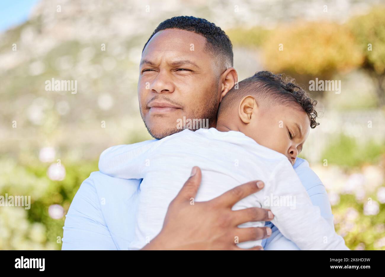 I could go for a nap too. a father and son bonding outside Stock Photo ...