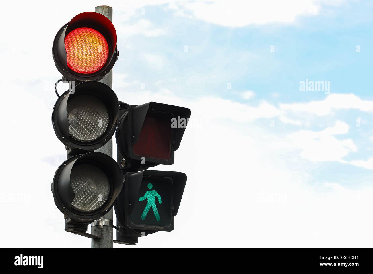 Vehicle traffic light in red, next to pedestrian which is green on a ...