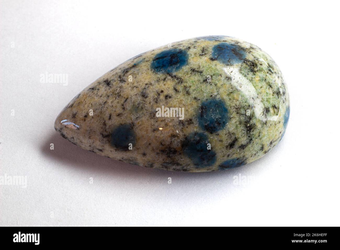 K2 Jasper, K2 granite, raindrop azurite macro photography on a white ...
