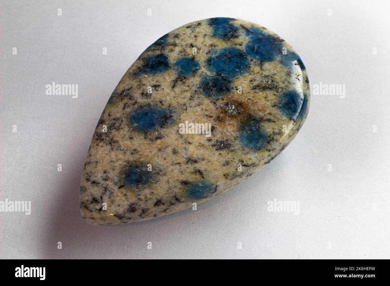 K2 Jasper, K2 granite, raindrop azurite macro photography on a white ...
