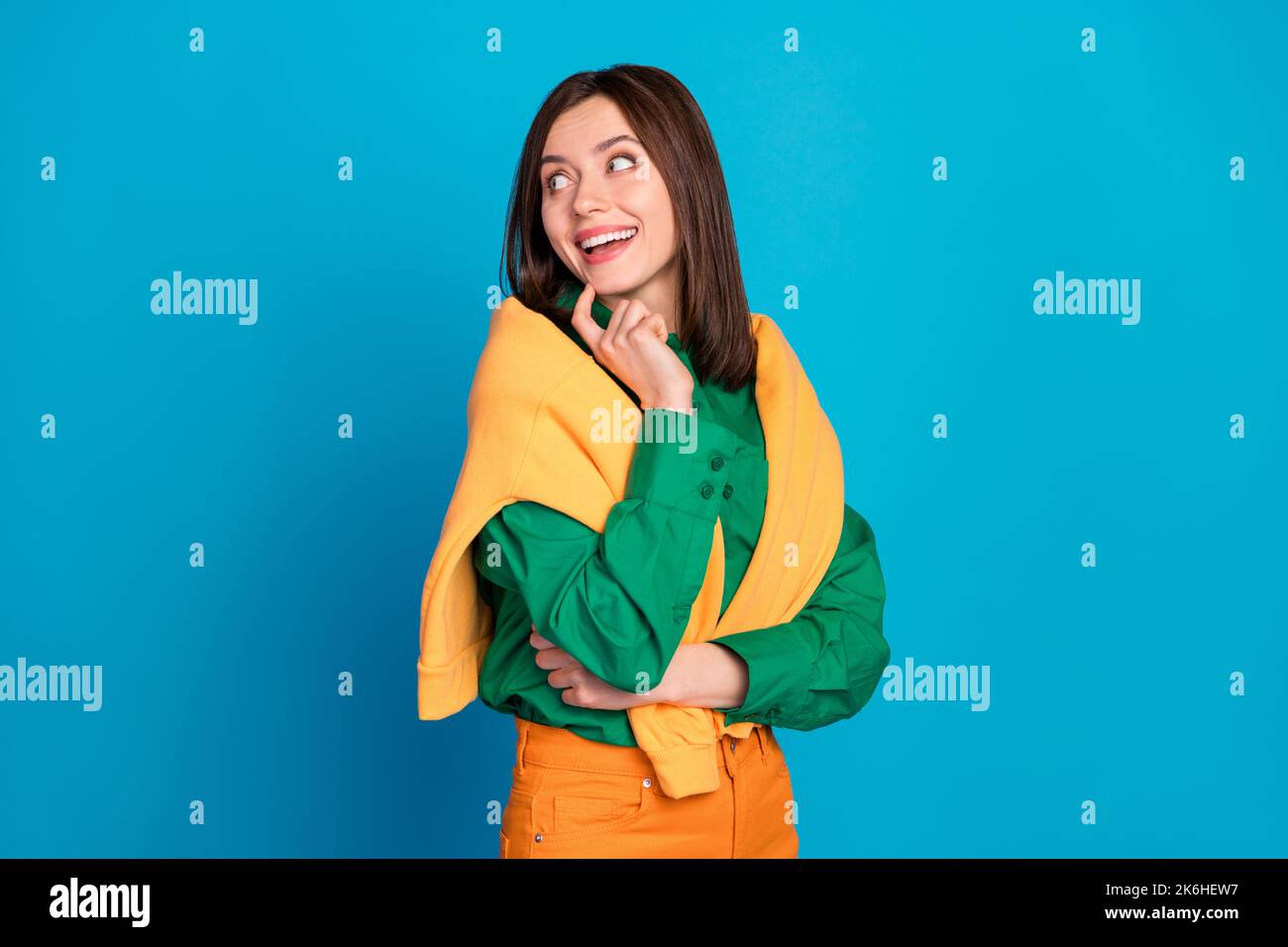 Portrait of pretty cheerful person finger touch chin toothy smile look ...