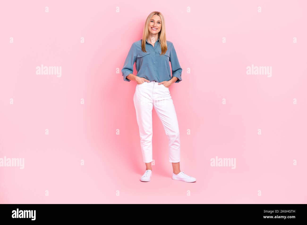 Full body photo of nice cheerful lady put hands pockets posing isolated ...