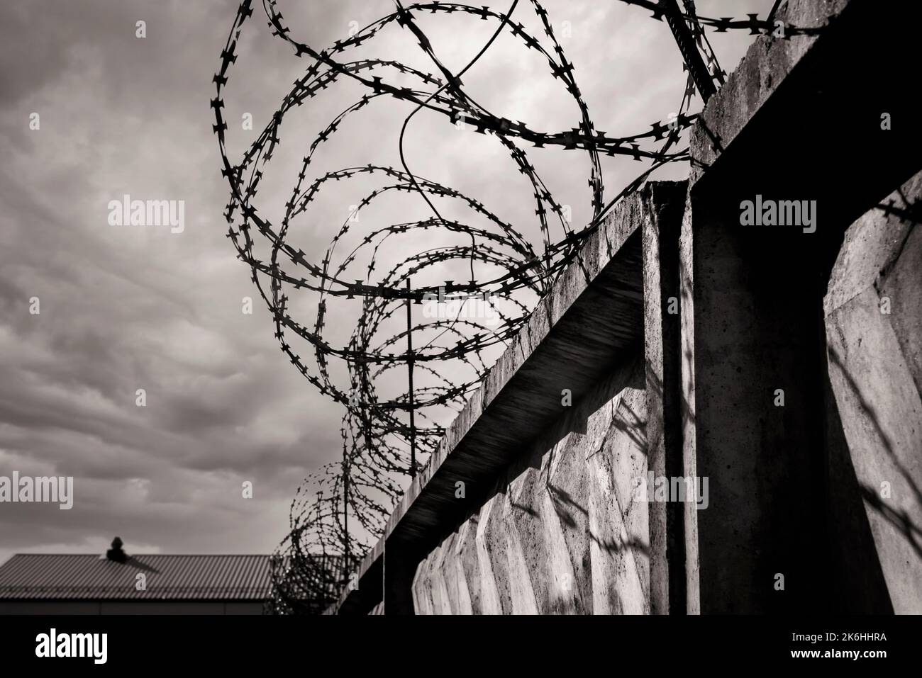 Prison. Prison wall with barbed wire. Law and justice Stock Photo - Alamy