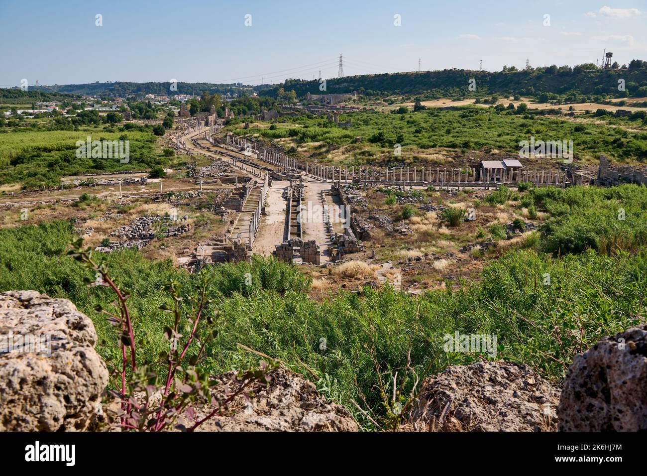 Aerial of columned street in the ruins of the Roman city of Perge ...