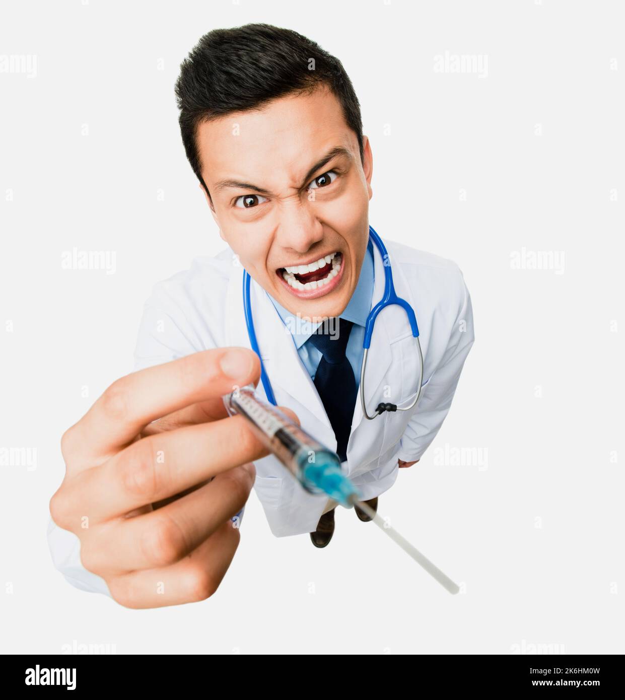 The latest in medical cures. a young male doctor ready to administer an ...