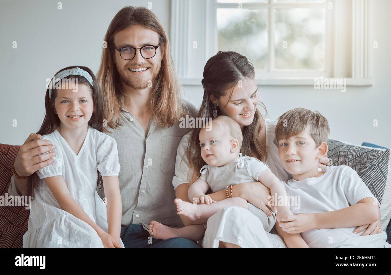 Adoring my growing family. a young family bonding together at home ...