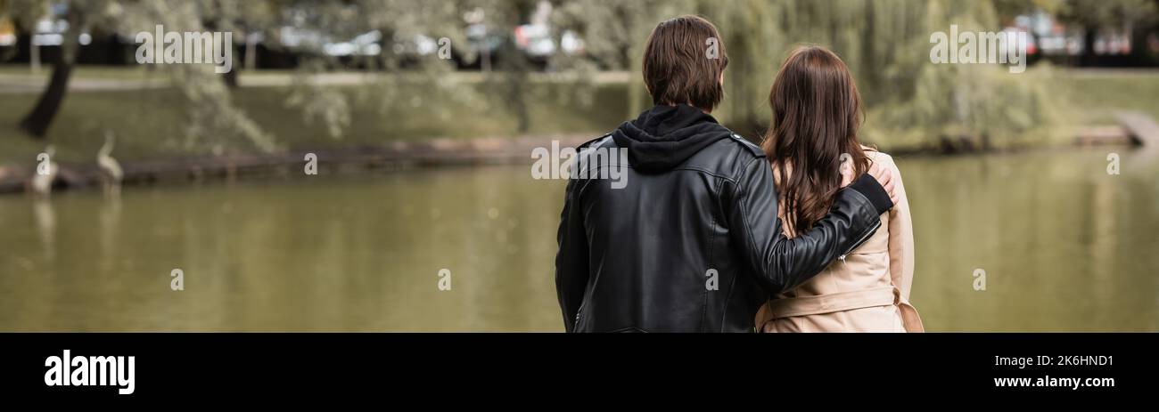 Man hugging back young brunette hi-res stock photography and images - Alamy