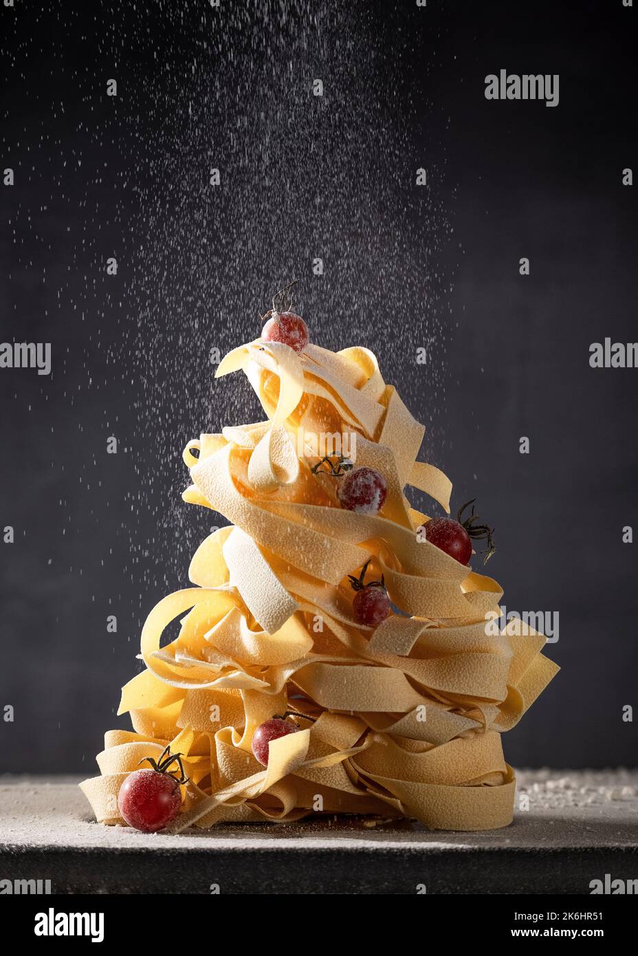 Christmas tree made by noodles and cherries tomatoes Stock Photo - Alamy
