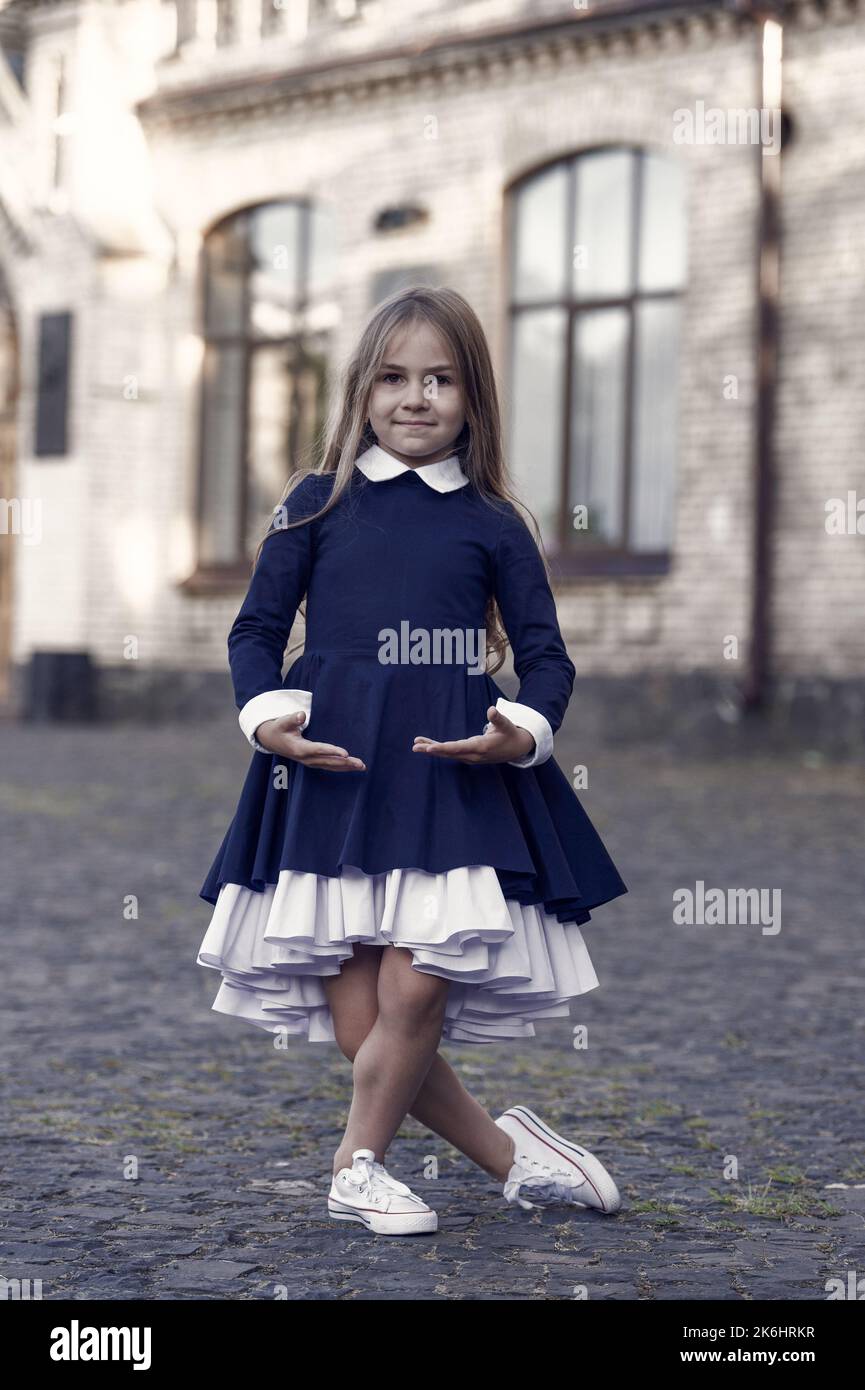 Plie style stance. Little ballerina wear school uniform. Small ballet ...