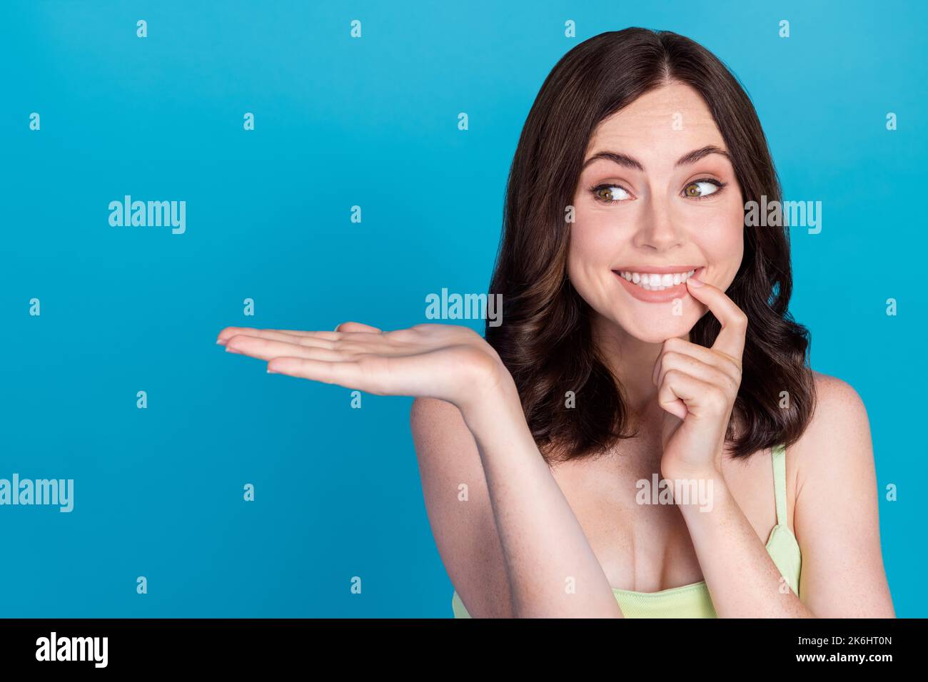 Photo of tricky cunning girl dressed green dress finger lips holding ...