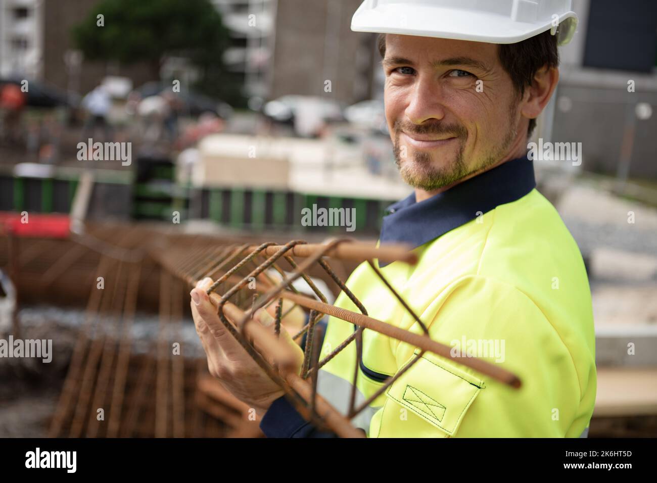 builder in uniform and white helmet Stock Photo - Alamy