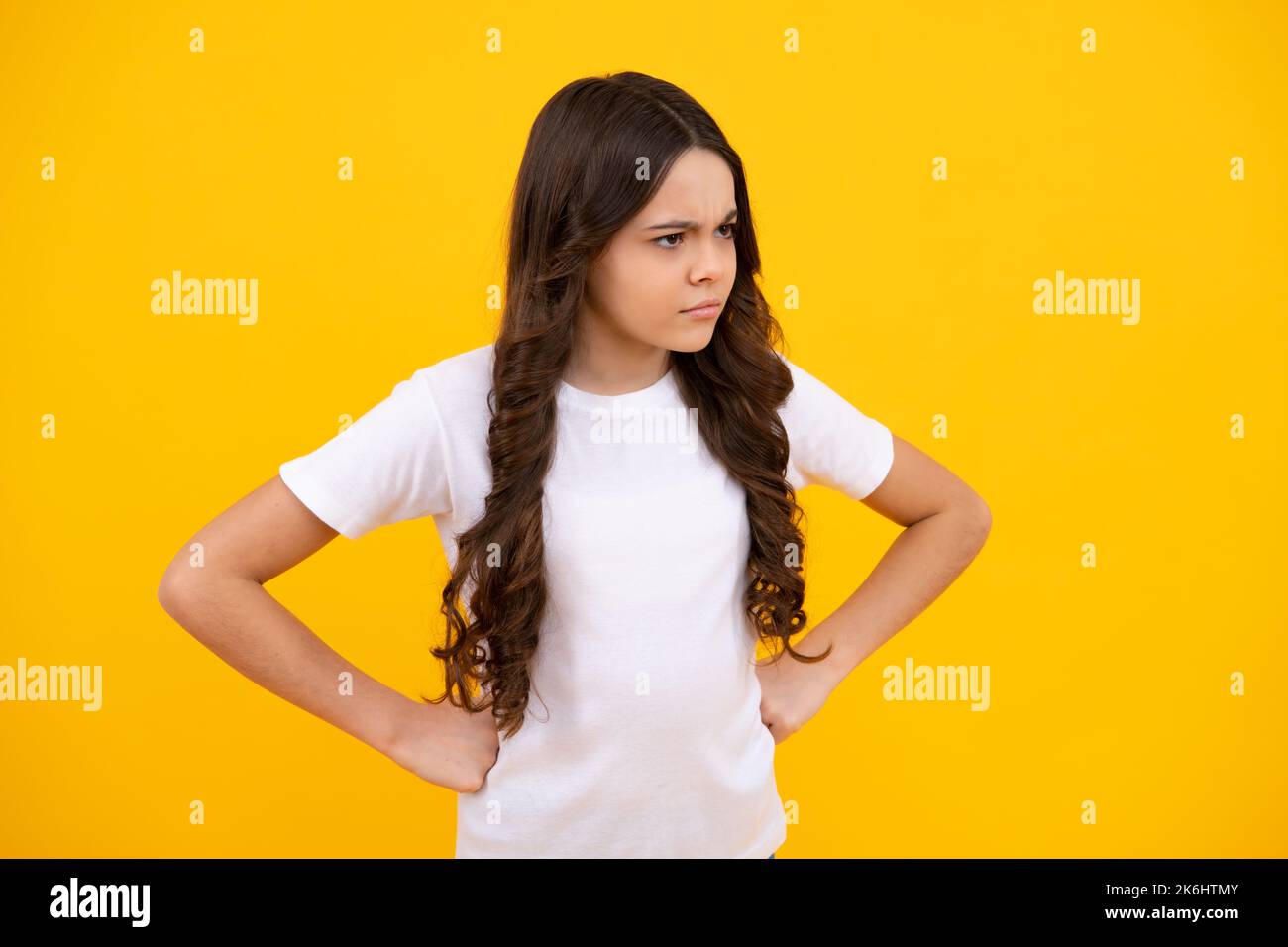 Angry teen girl. Child looking at camera with hate and rage negative ...