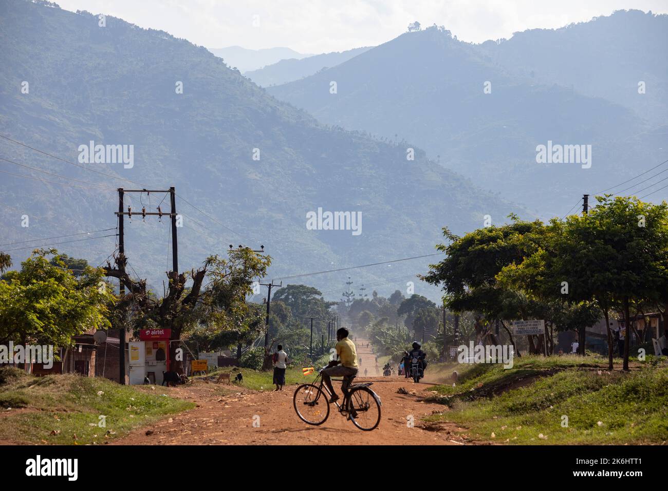 Small town along a dirt road through the Rwenzori Mountains in Kasese ...