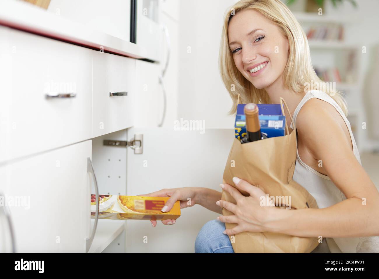 Put away groceries kitchen hi-res stock photography and images - Alamy