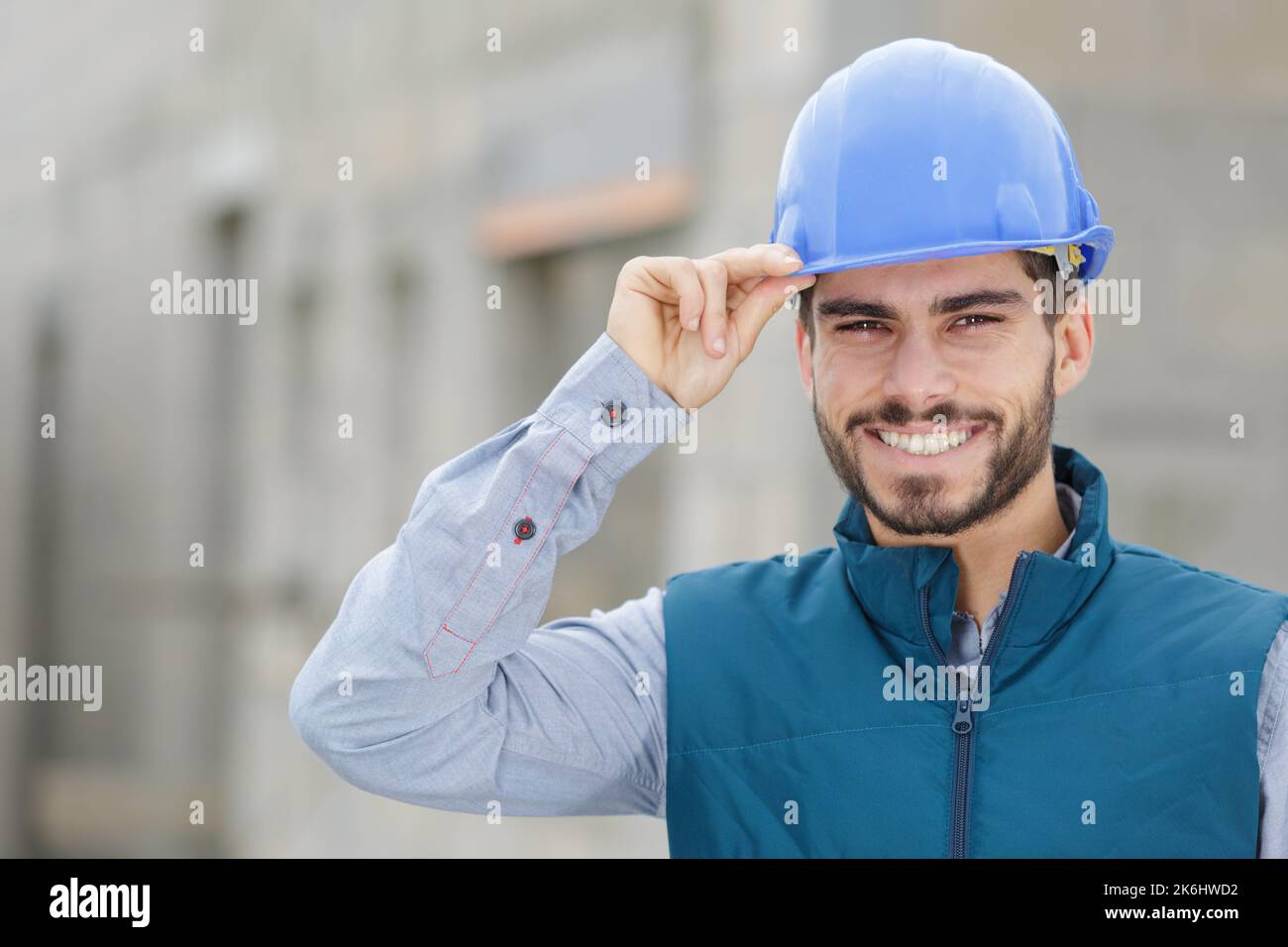 happy man construction worker smiling at camera Stock Photo - Alamy