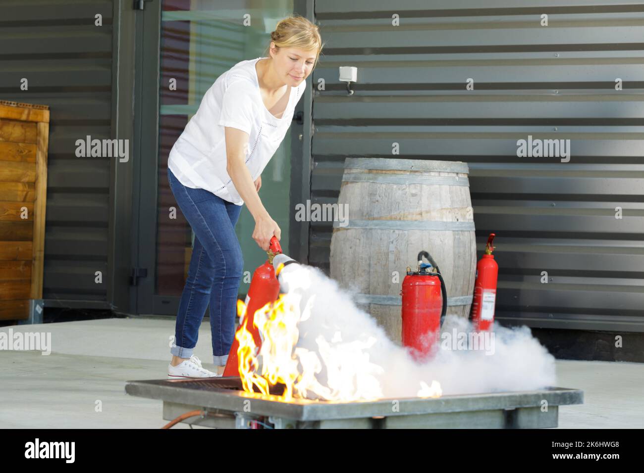 Beautiful woman fire extinguisher hi-res stock photography and images ...