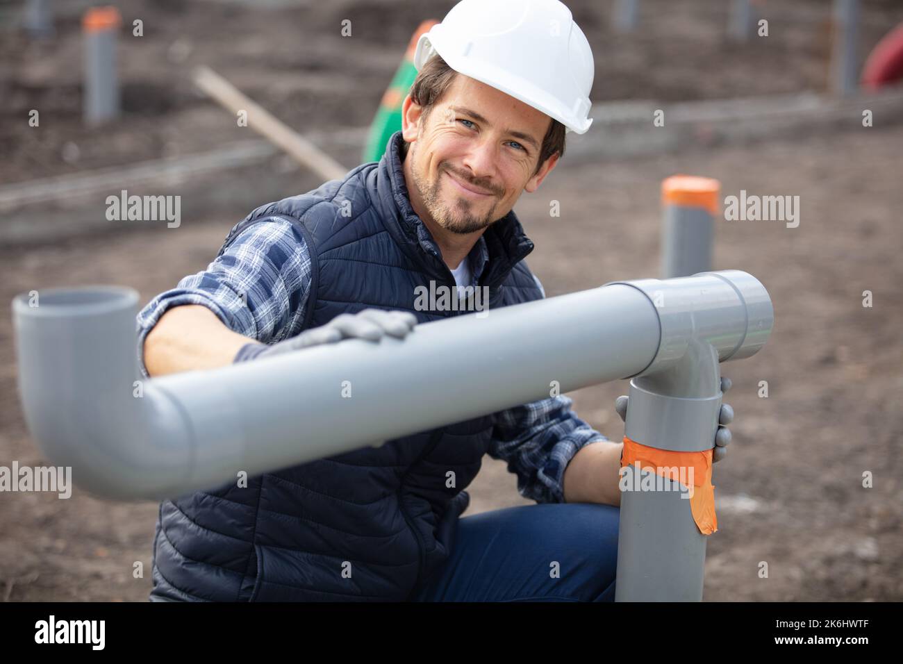 home renovation plumber fixing sewerage pipe Stock Photo - Alamy