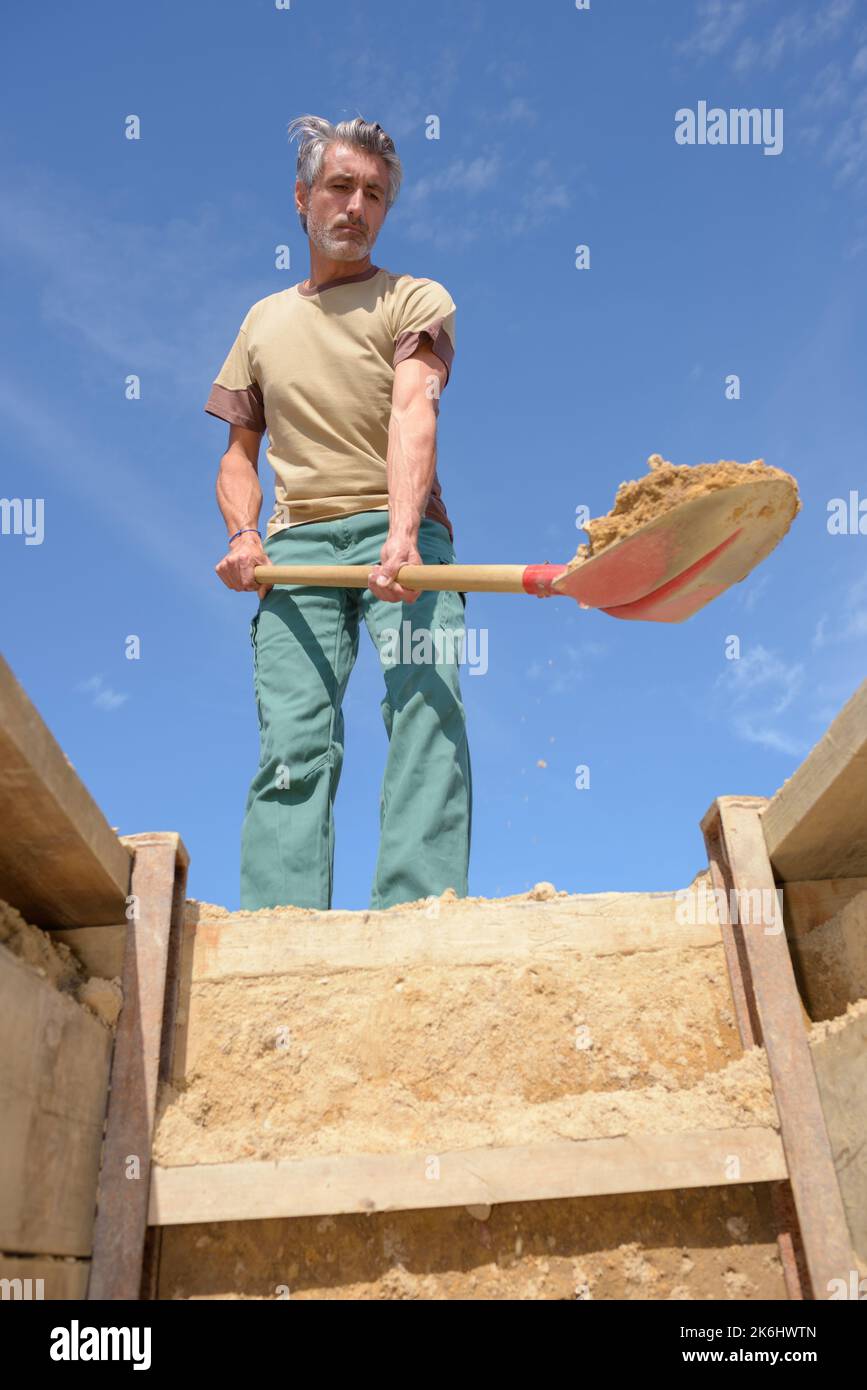 male cemetery worker digging a grave Stock Photo - Alamy