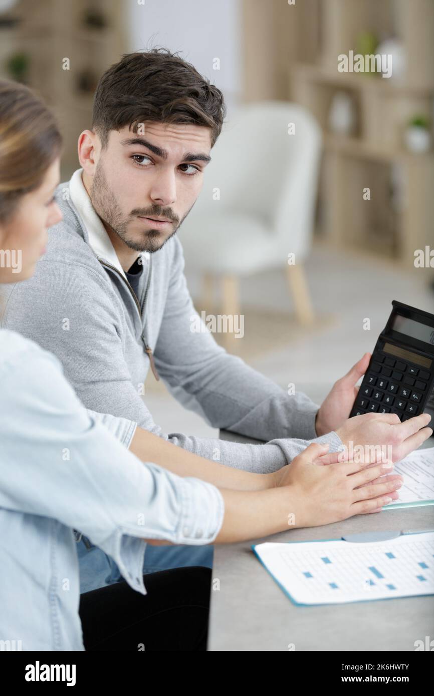 young serious couple holding reading financial documents Stock Photo ...