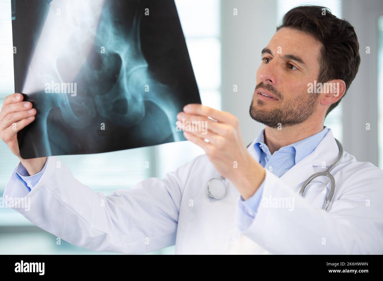 a radiologist man checking xray Stock Photo - Alamy