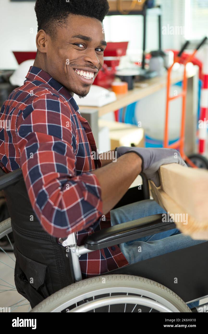 disabled man working in carpentry workshop Stock Photo - Alamy