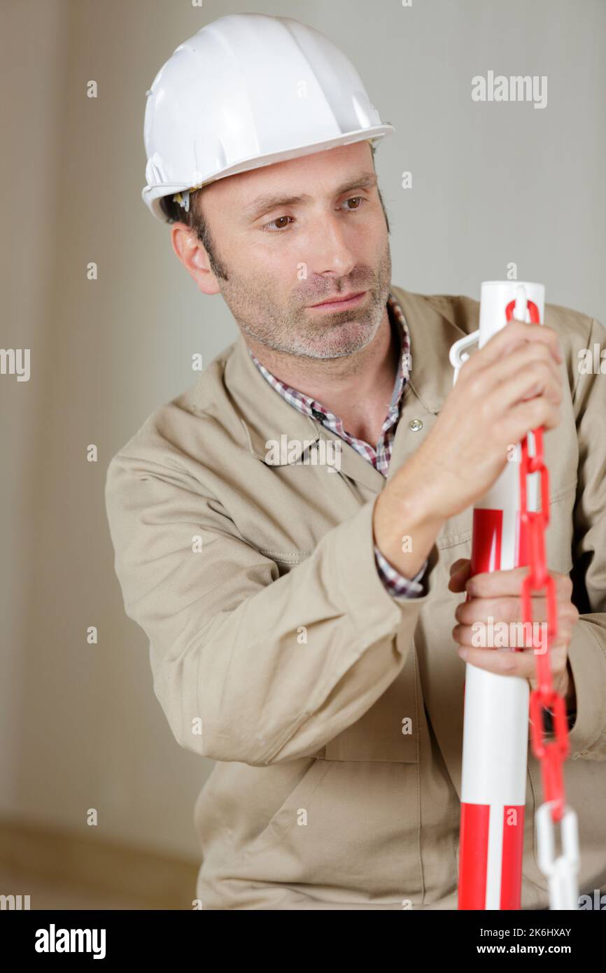 builder man working with chain Stock Photo - Alamy