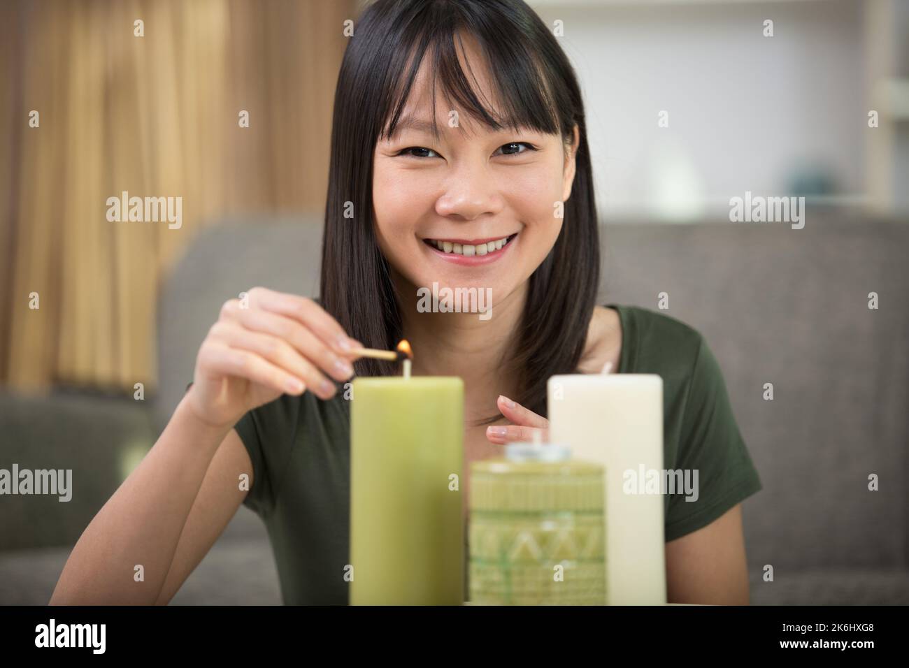 beautiful girl lighted a candle Stock Photo - Alamy