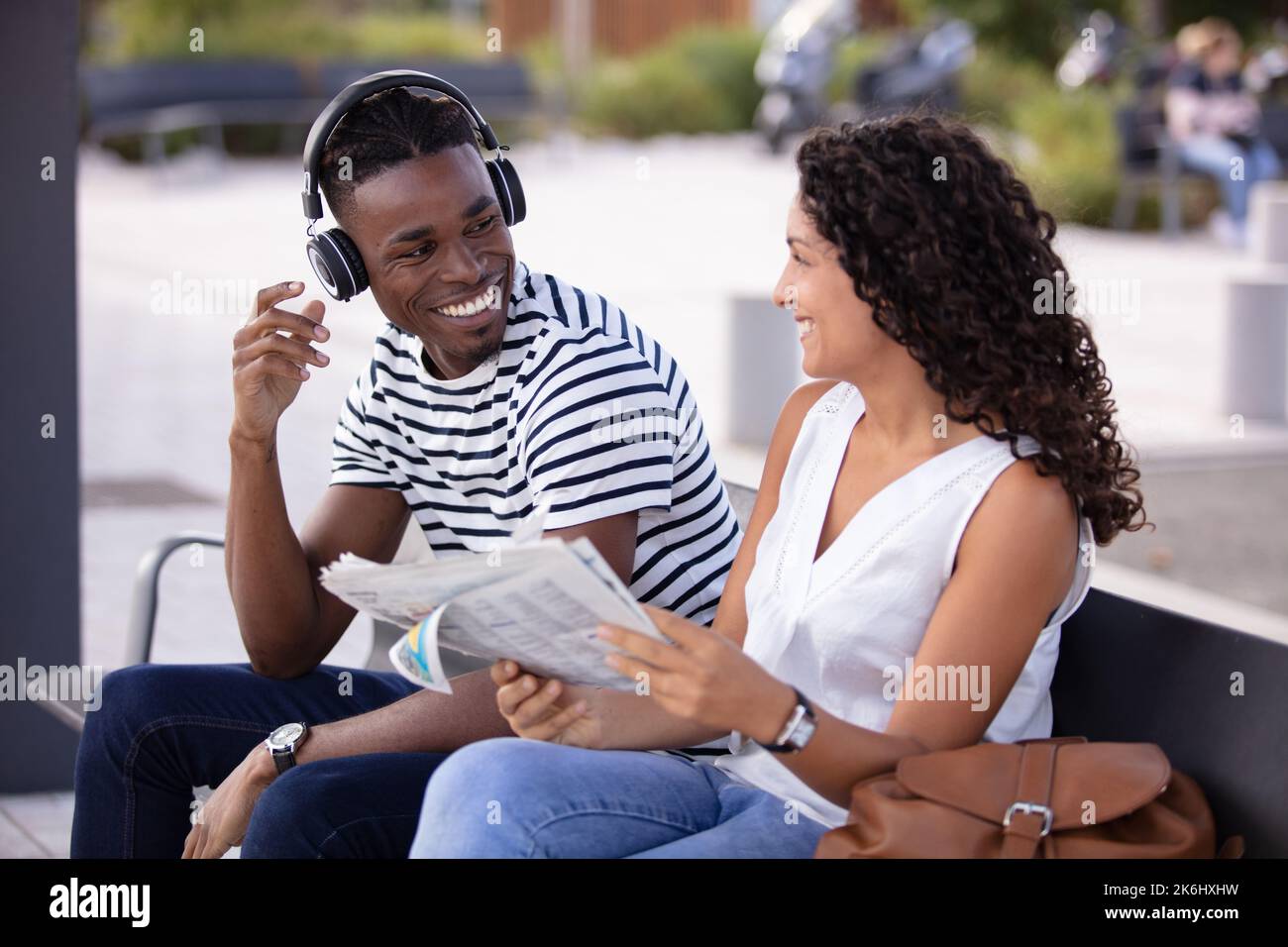 two people conversation on a bench Stock Photo - Alamy
