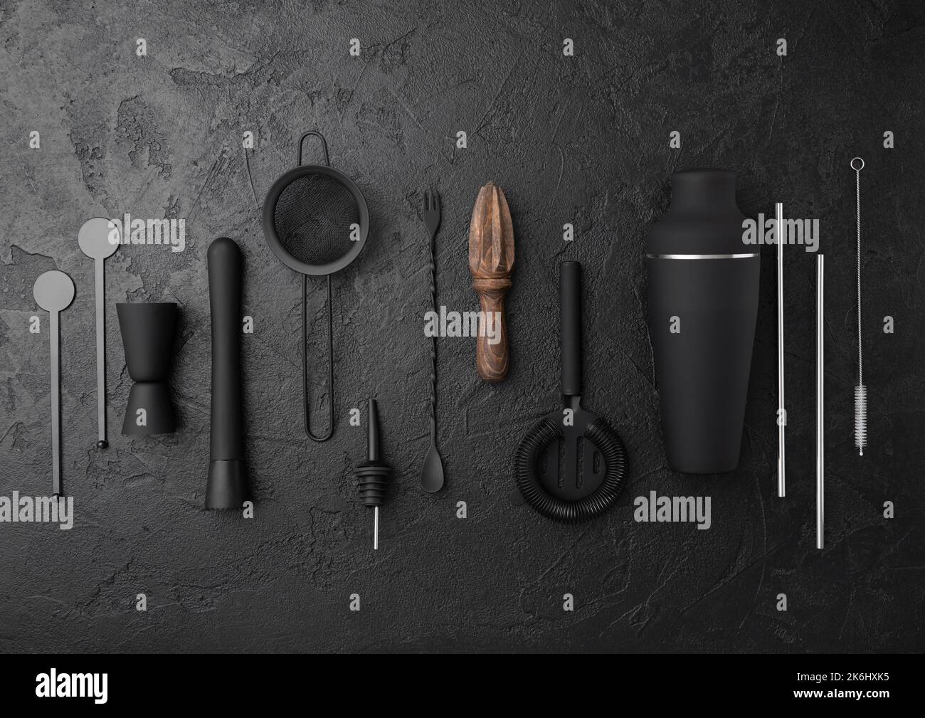 Various cocktail,bar utensils black matt steel set on black background ...