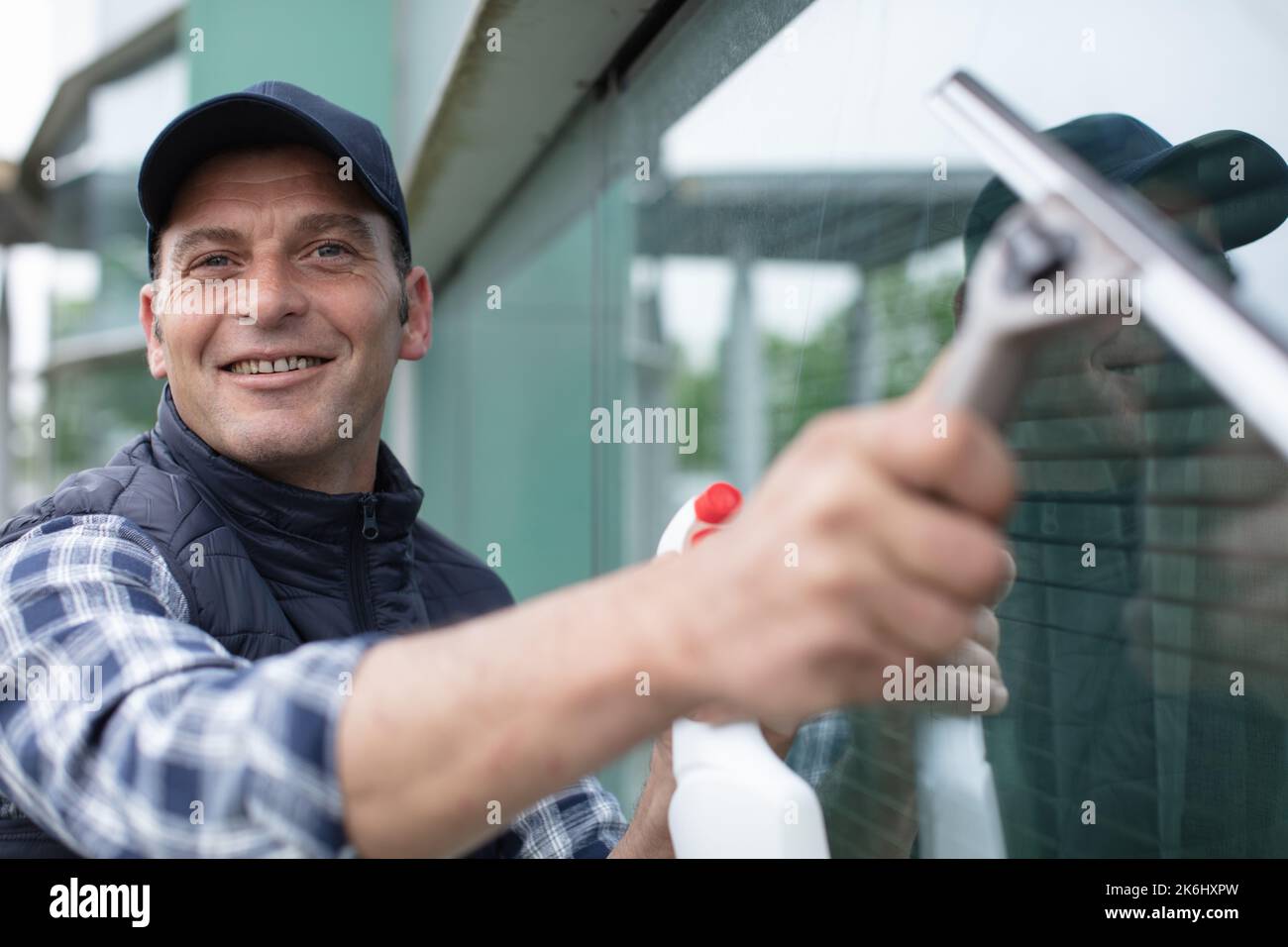 young man washing window view through glass Stock Photo - Alamy