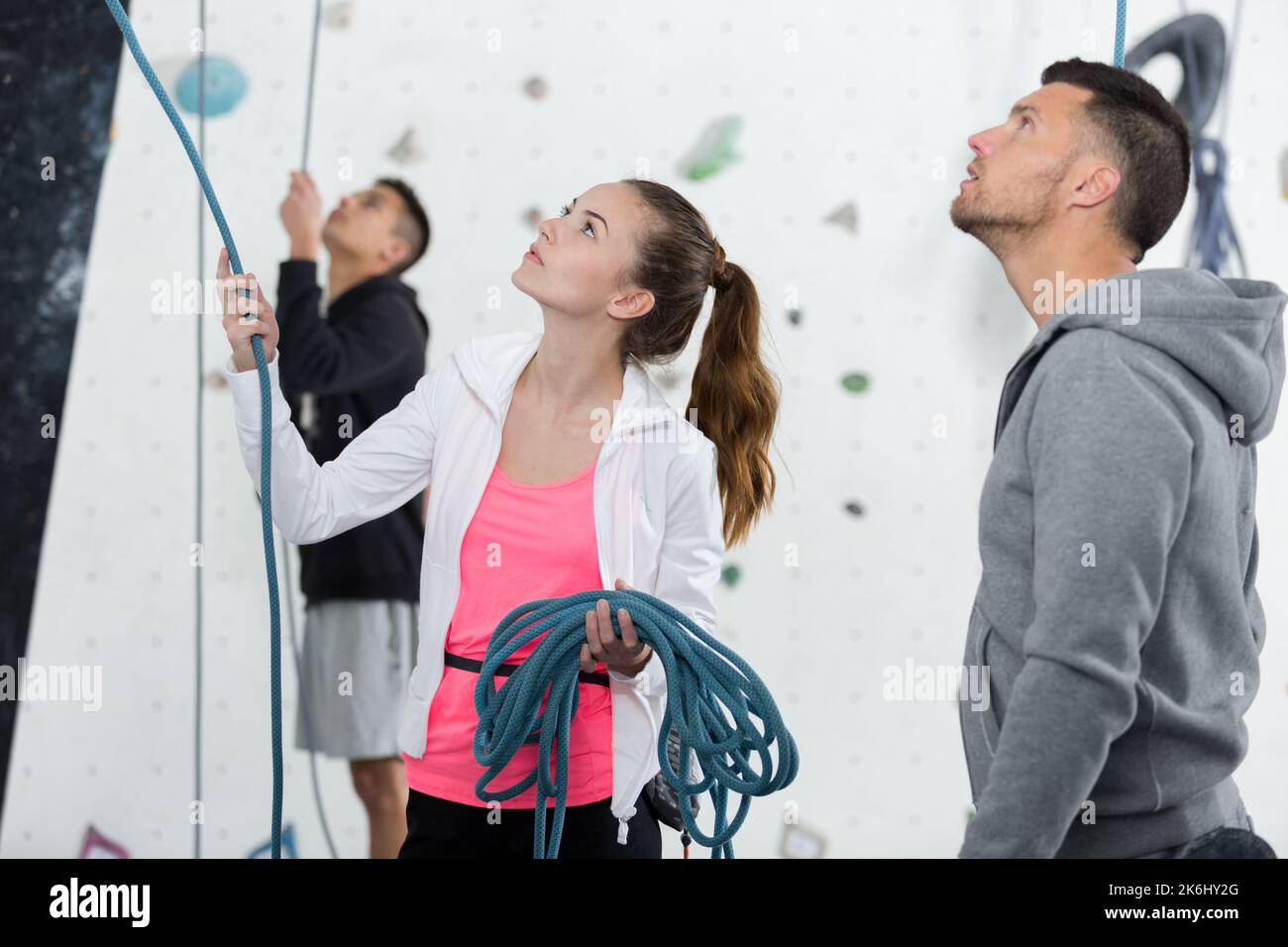 couple ready to start climbing a gym wall Stock Photo - Alamy