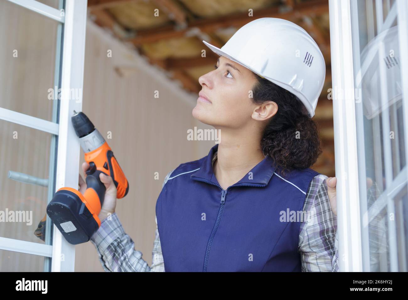 construction worker before drilling a window Stock Photo - Alamy
