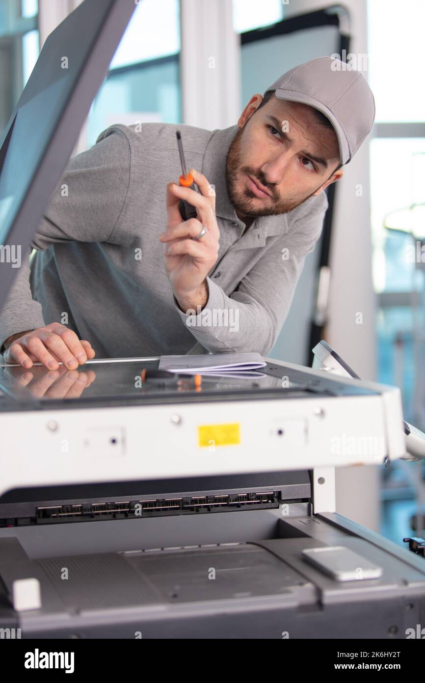 Technician man repairing photocopy hi-res stock photography and images ...