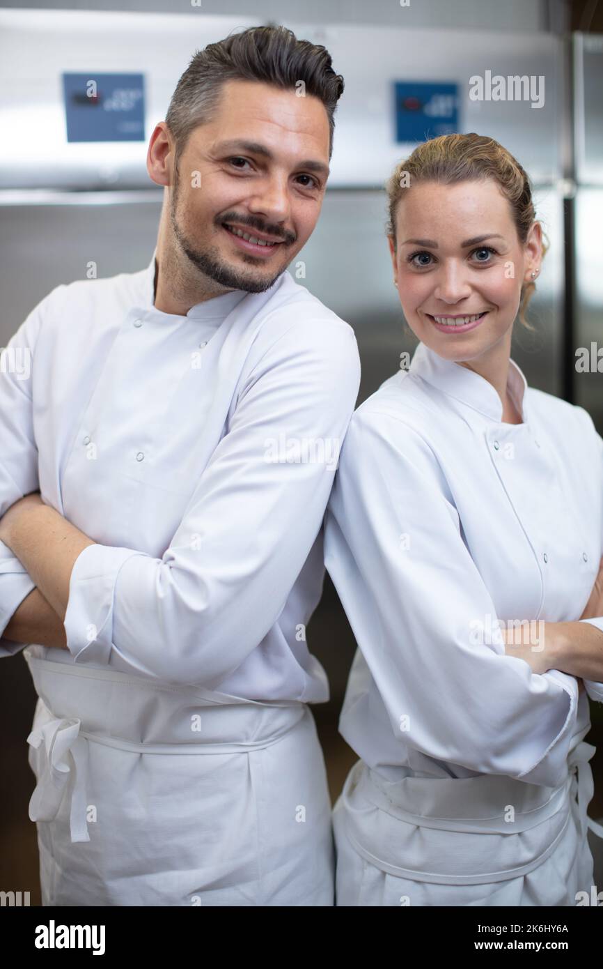 portrait of male and female chefs stood side by side Stock Photo - Alamy