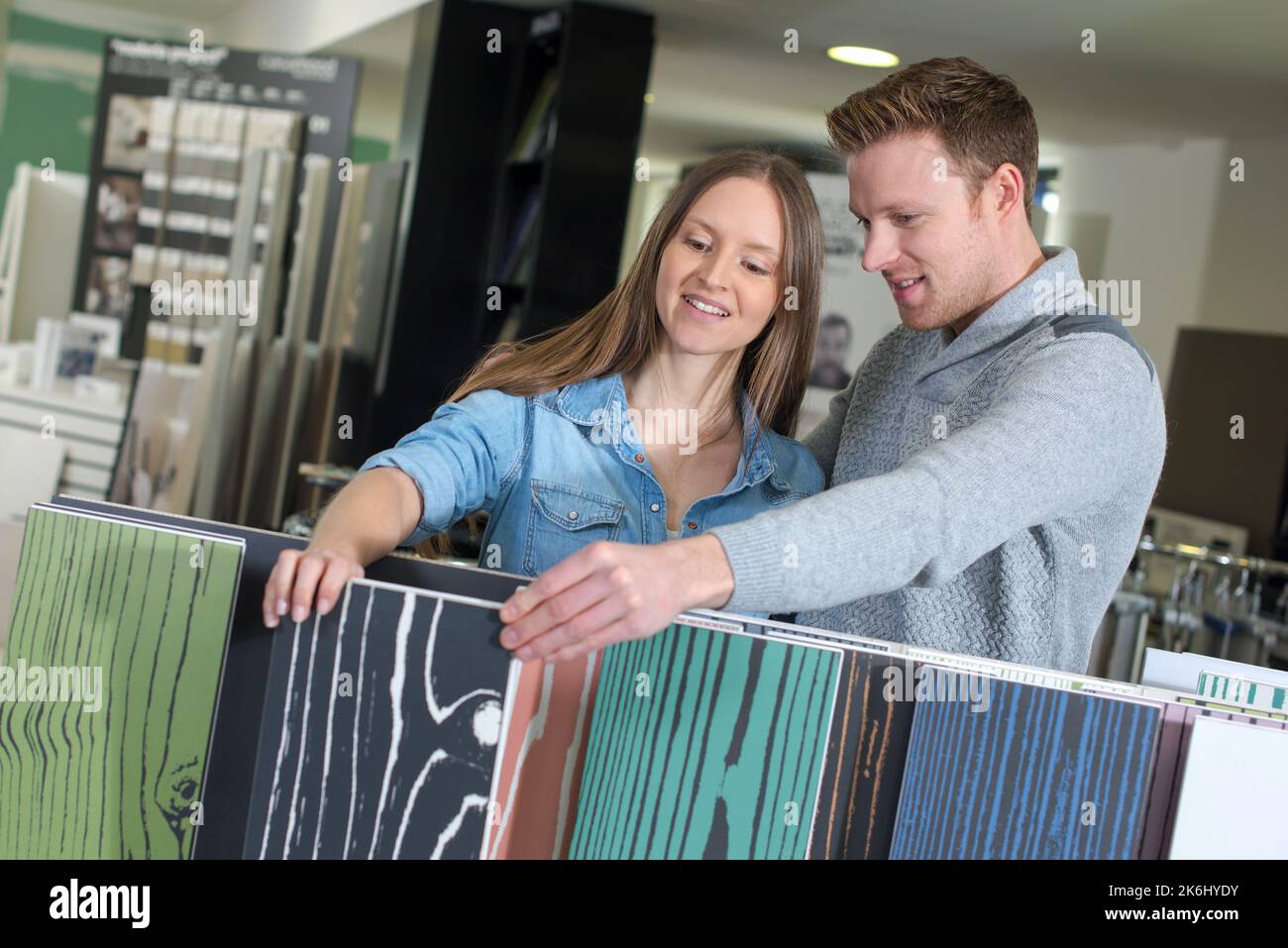 couple pointing at ceramic mosaic tile Stock Photo - Alamy