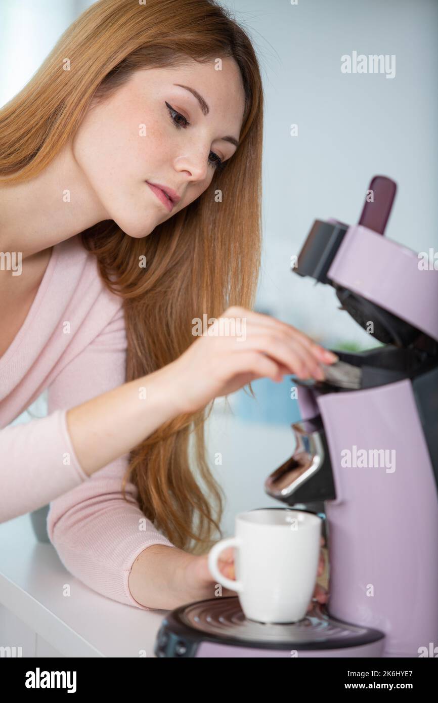 woman making fresh espresso in coffee maker Stock Photo - Alamy