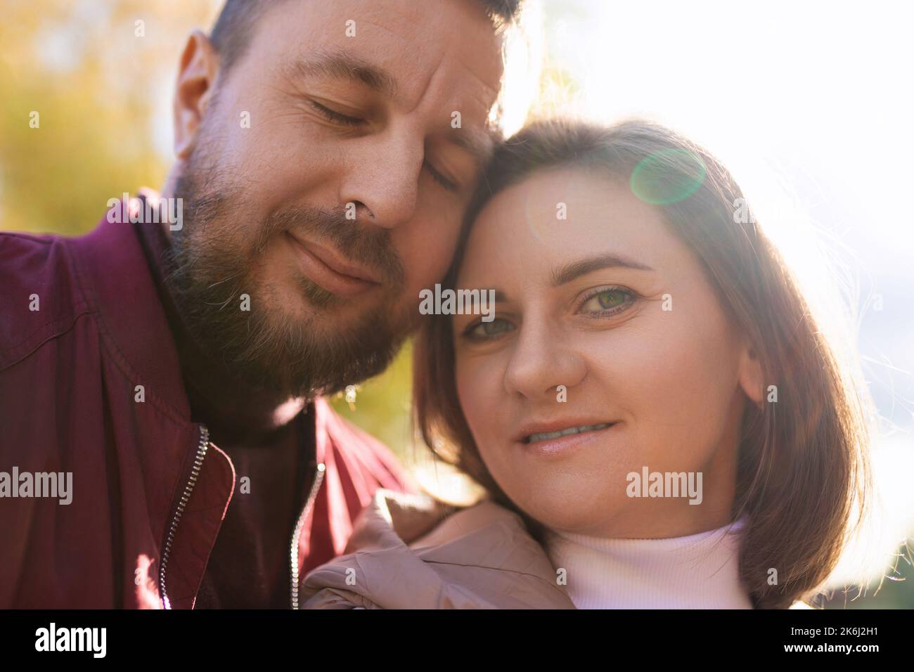 close-up of happy traditional family with smile on face, husband with ...
