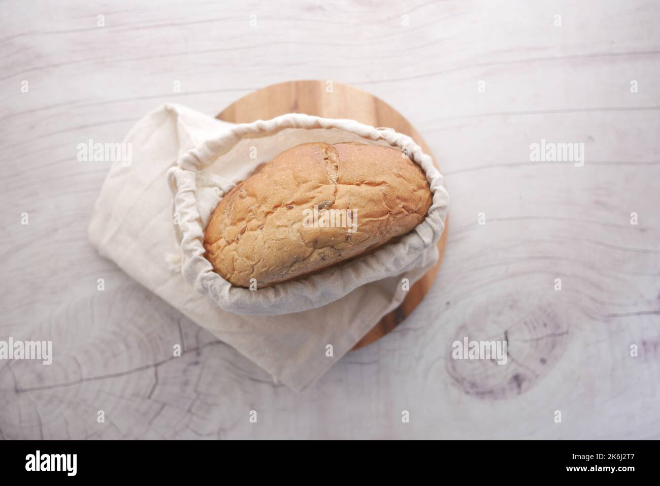 baked bread stored in a reusable linen bag . Eco friendly Zero waste ...