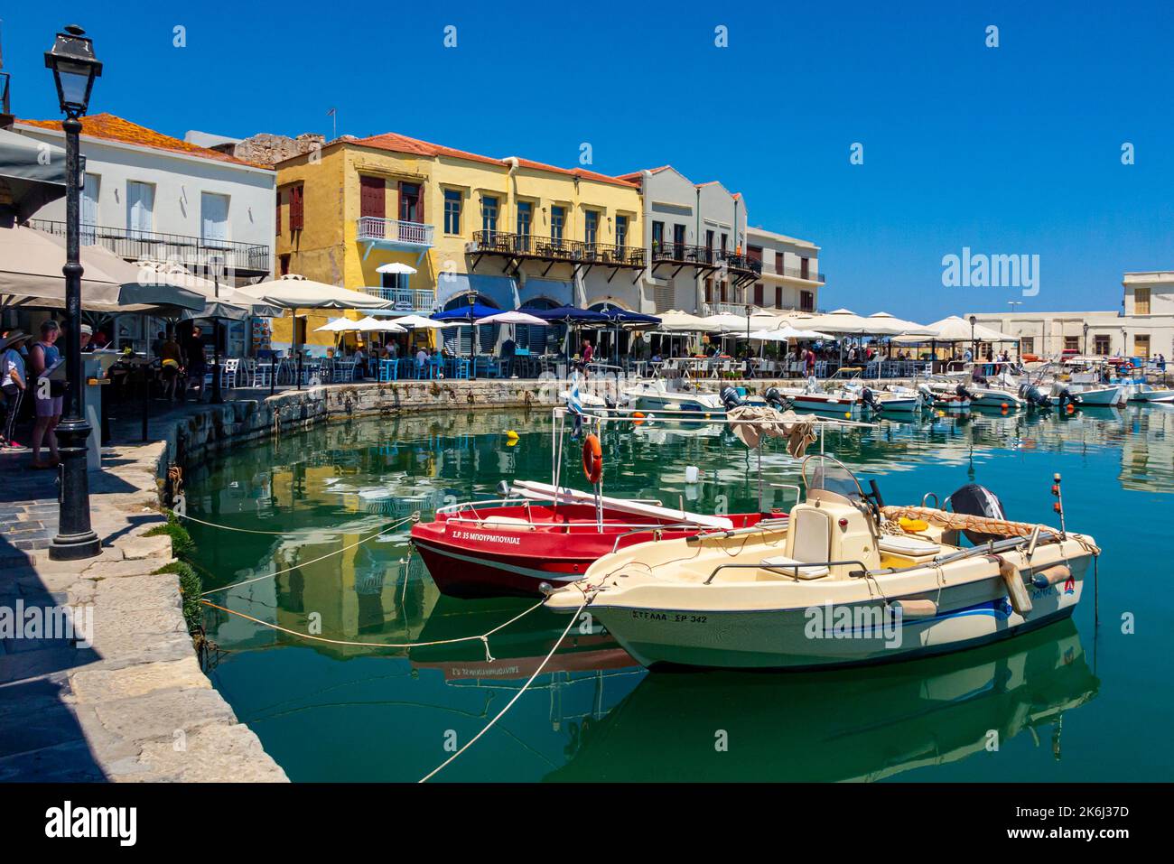 Boats moored in the old harbour at Rethymno or Rethymnon a resort town ...