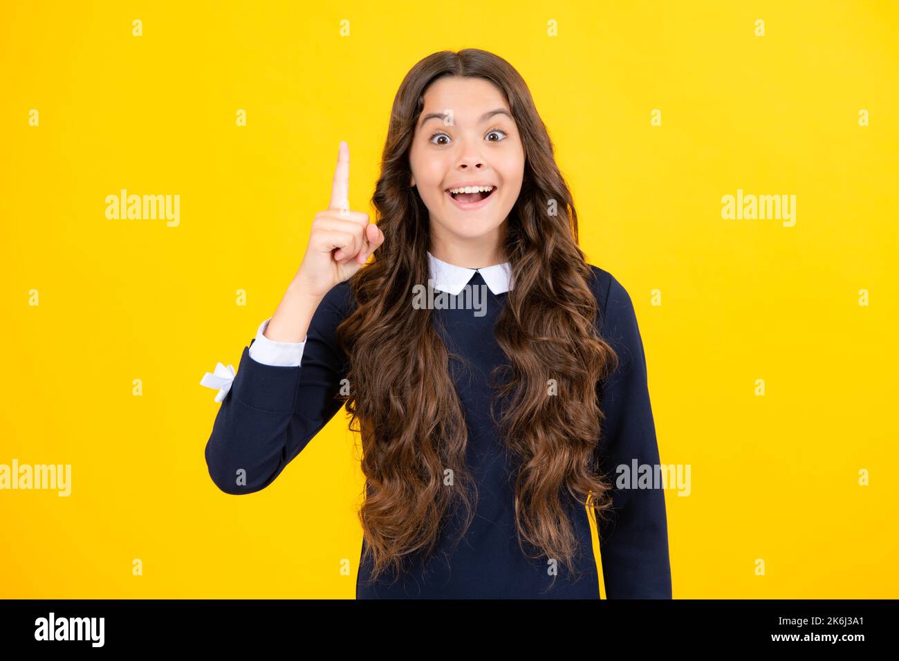 Confident and successful young teenager child over isolated yellow ...