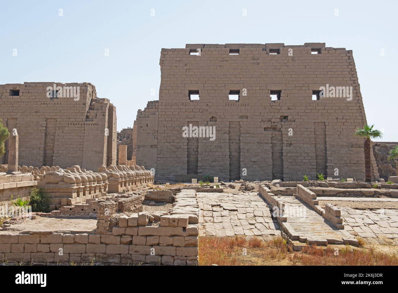 Large sphinx statues in ancient egyptian Karnak Temple with entrance ...