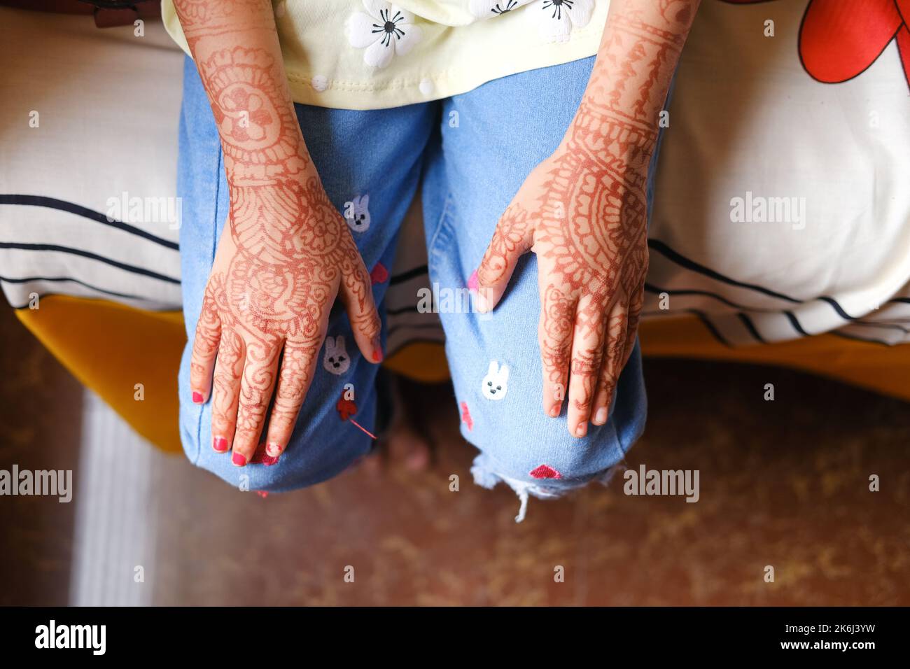 child girl applying henna on hand Stock Photo - Alamy