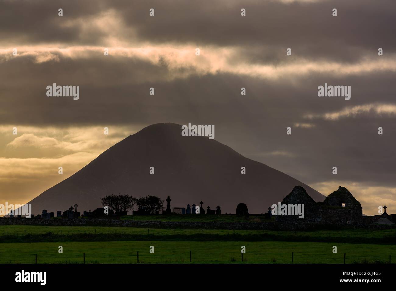 Ruins of Doona church and the old cemetary at Tullaghan Bay at sunset ...