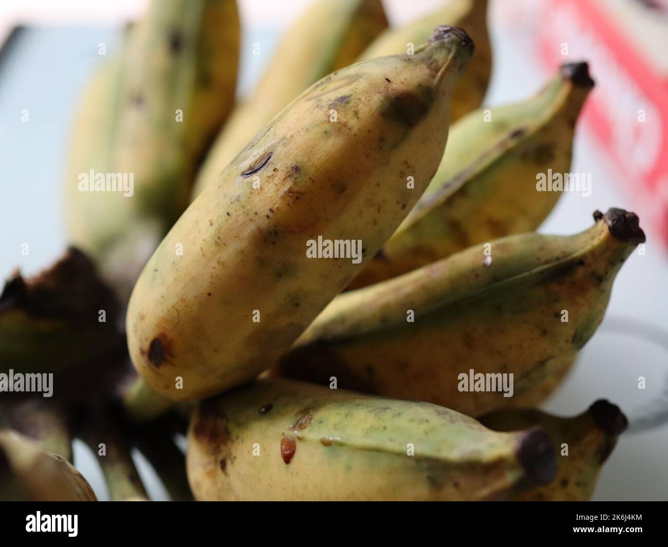 small yellow banana close up Stock Photo - Alamy