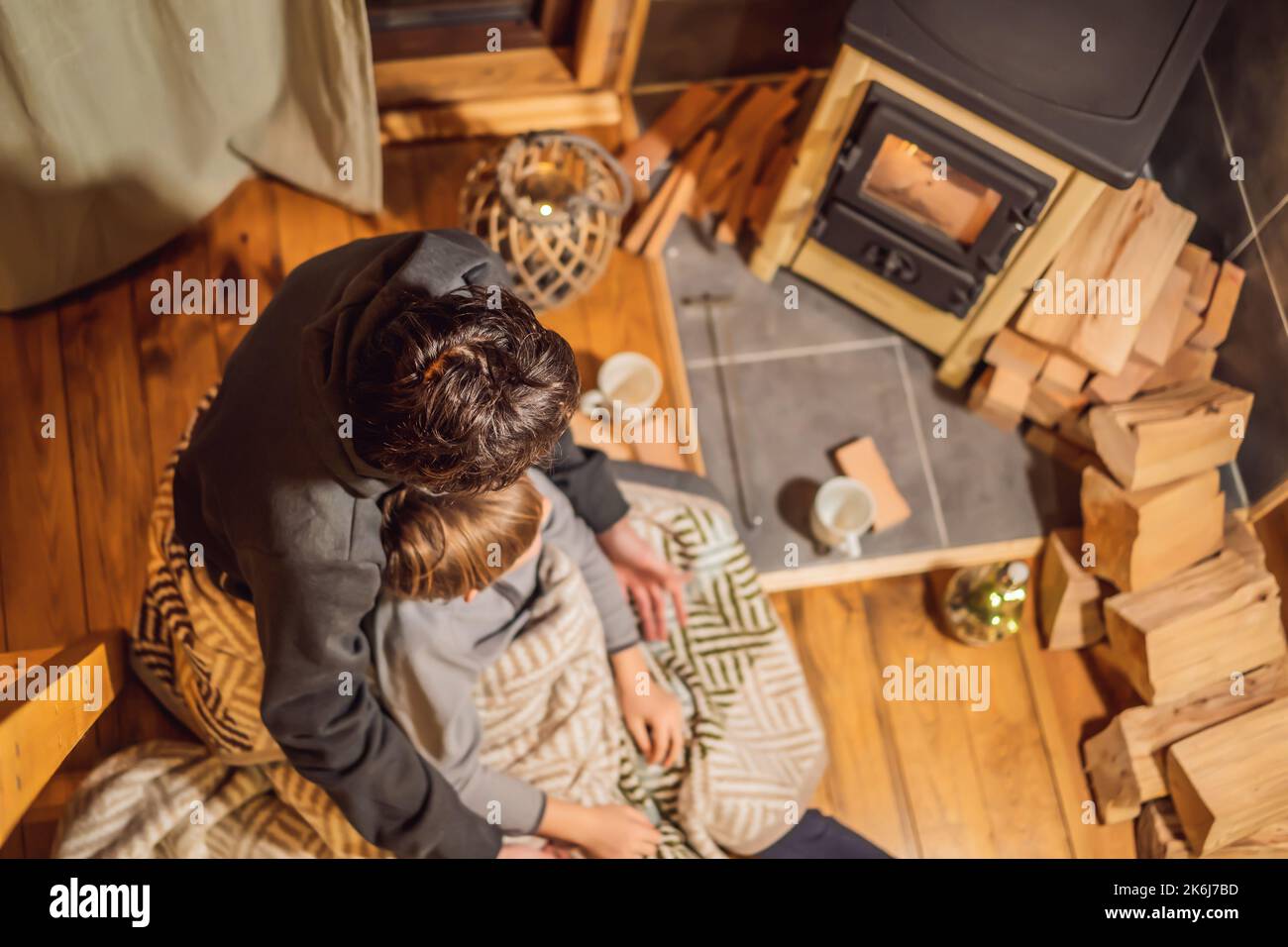 Sitting by fire wood cabin hi-res stock photography and images - Alamy