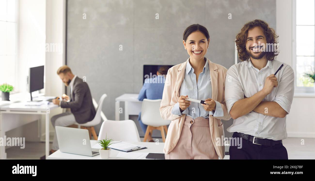Banner with portrait of two happy smiling business people standing in ...