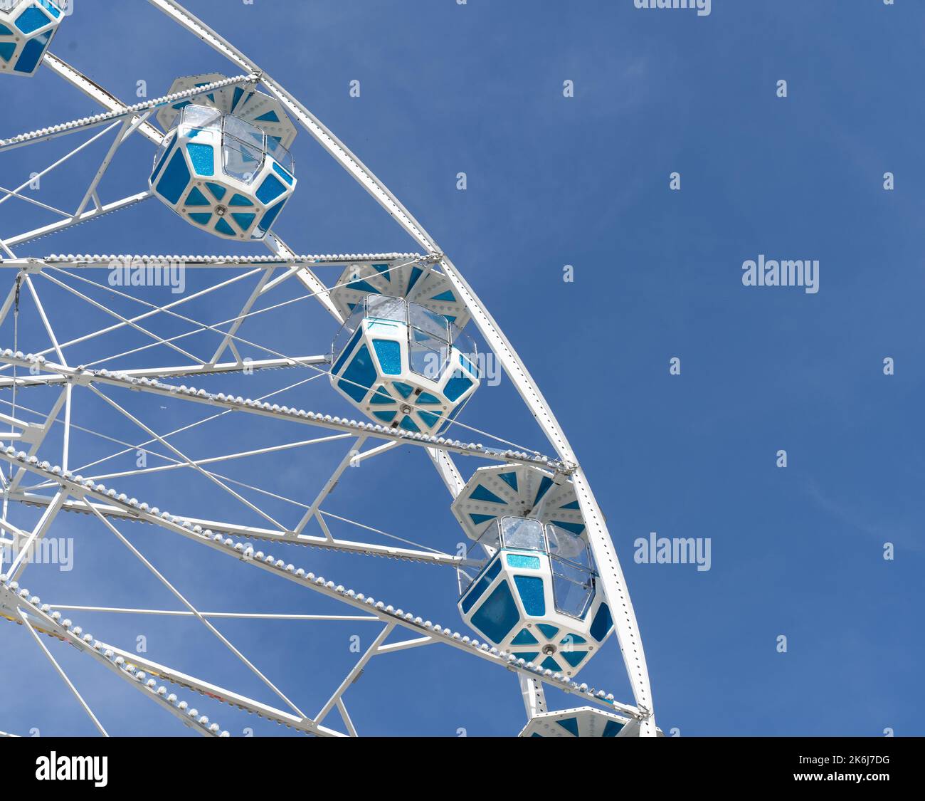 Carnival ferris wheel against a blue-sky background Stock Photo - Alamy