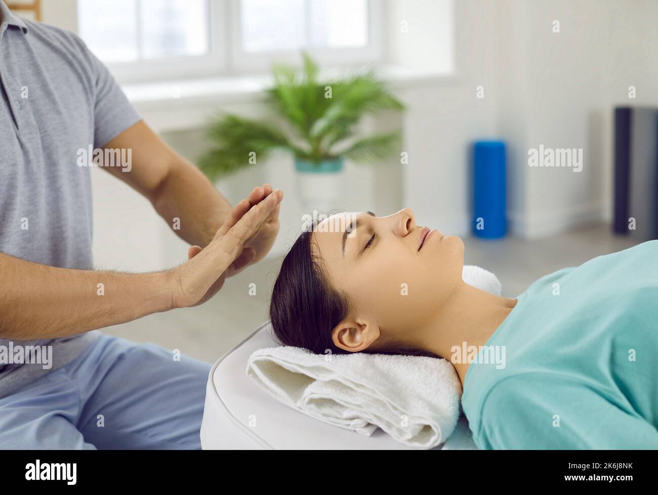 Young woman relaxing and restoring energy during therapy session with ...