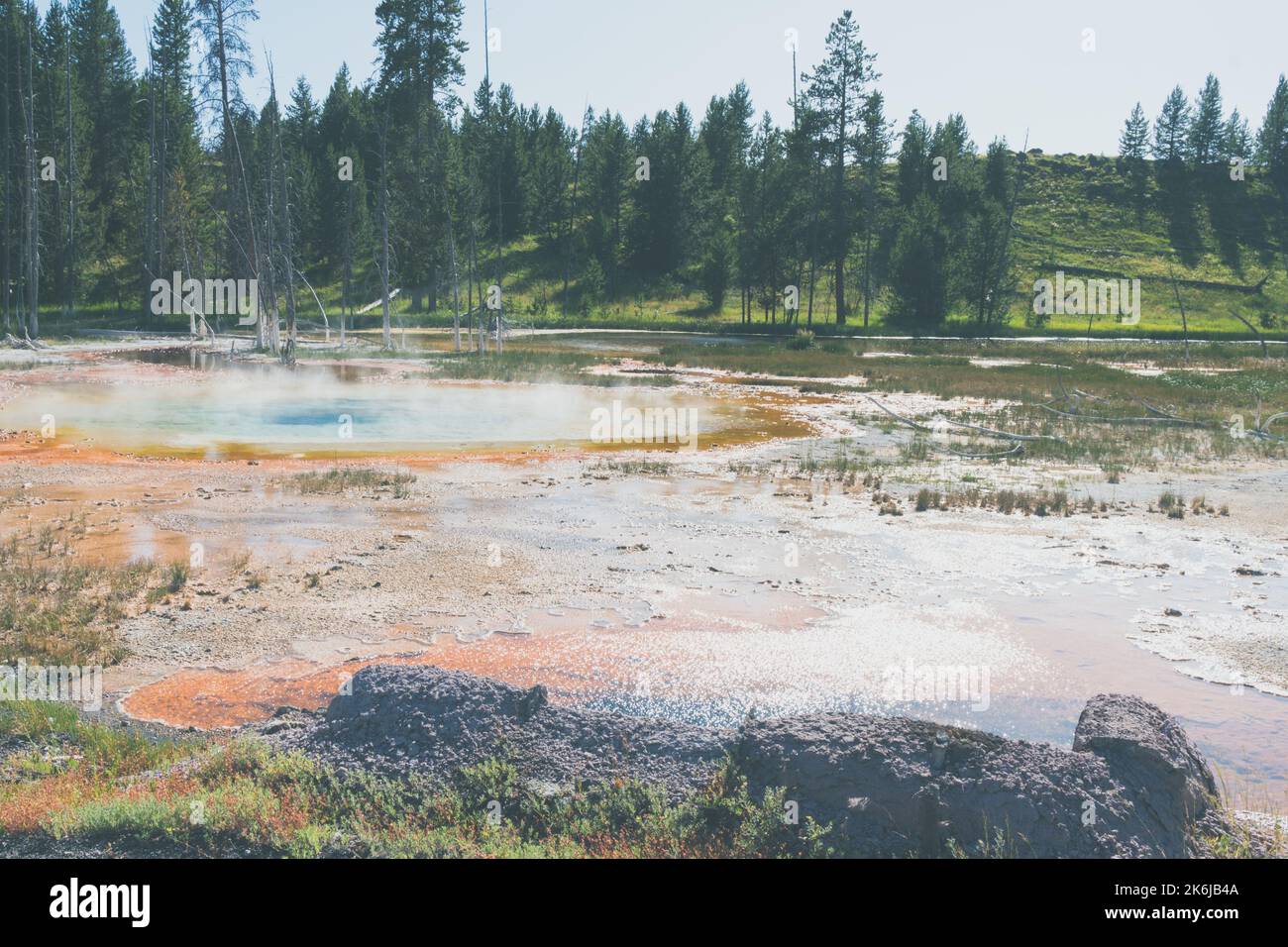 Geothermal area in Yellowstone National Park in the summer sunshine ...
