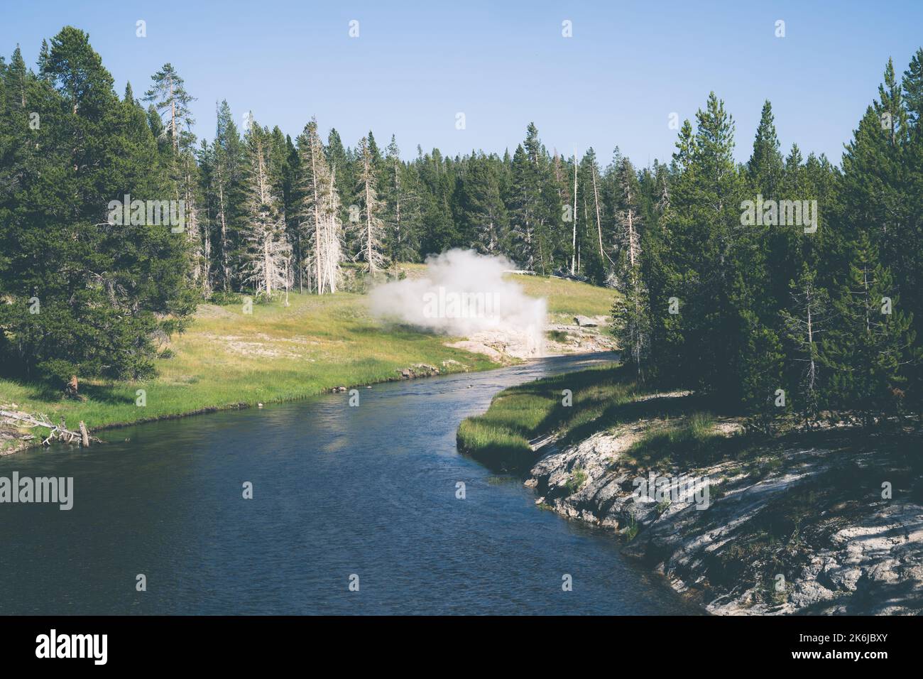 Yellowstone River, as Riverside Geyser erupts Stock Photo - Alamy
